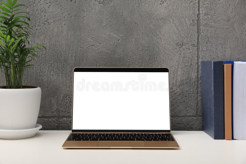 Workplace with Modern Laptop on White Table. Mockup for Design Stock ...