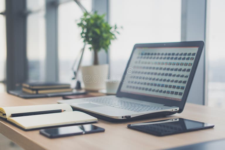 Workplace with Notebook Laptop Comfortable Work Table in Office Windows ...