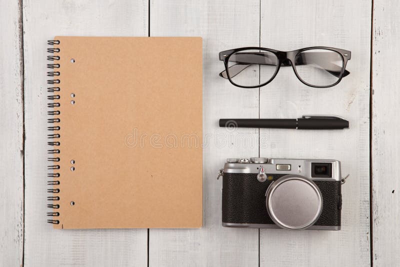 Workplace with Notepad, Camera, Pen and Glasses Stock Image - Image of ...
