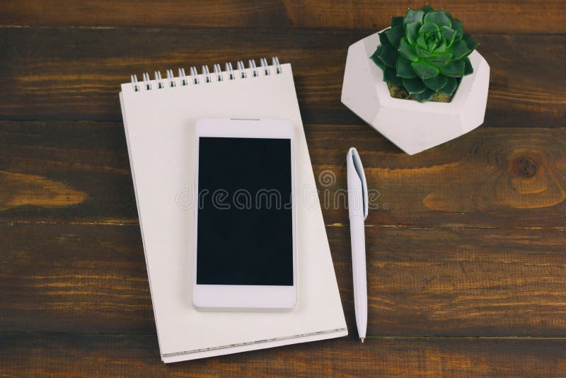 Workplace with Notepad, Phone with Blank Black Screen, Pen, Pencil ...