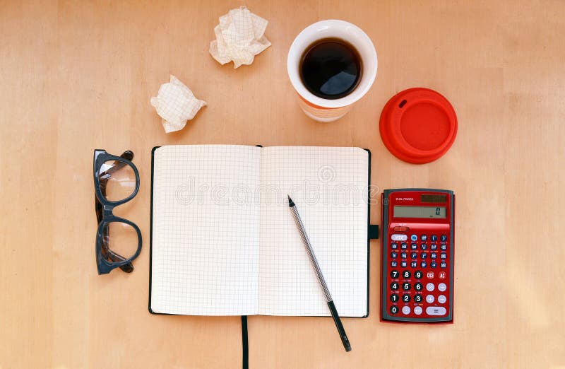 Workplace with Open Notebook, Glasses, Calculator and Cup of Coffee or ...