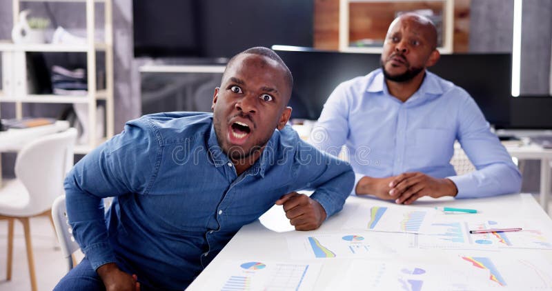Workplace Quarrel. Angry Looking Man Looking Stock Image - Image of ...