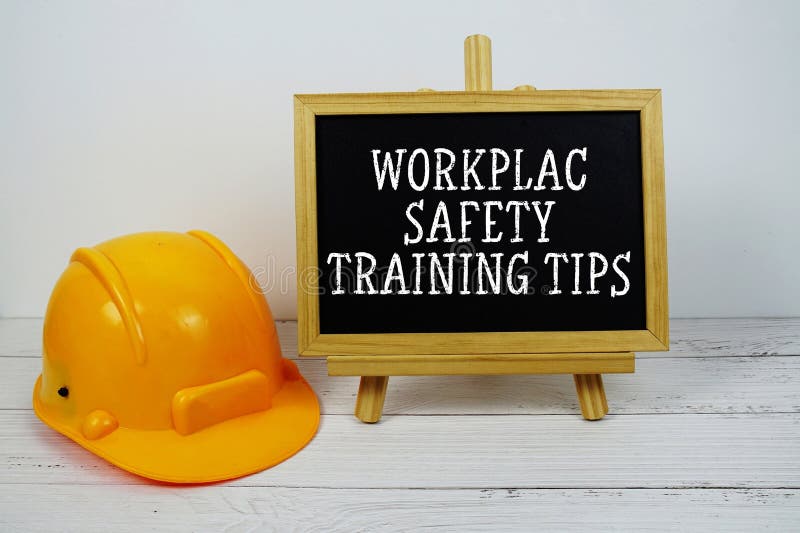 Workplace Safety Training Tips Text on Blackboard with Safety Helmet on ...