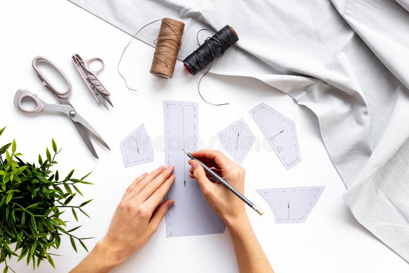 Workplace of Seamstress. Hands Doing Sewing Patterns with Fabric Stock ...