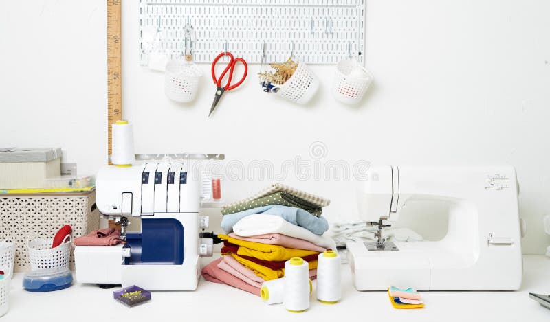 Workplace: White Table with a Sewing Machine and an Overlock for Sewing ...