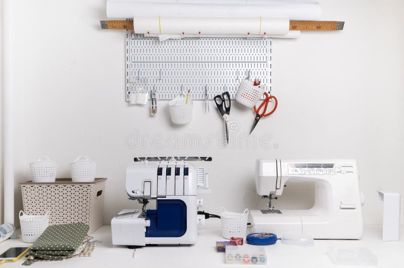 Workplace: White Table with a Sewing Machine and an Overlock for Sewing ...