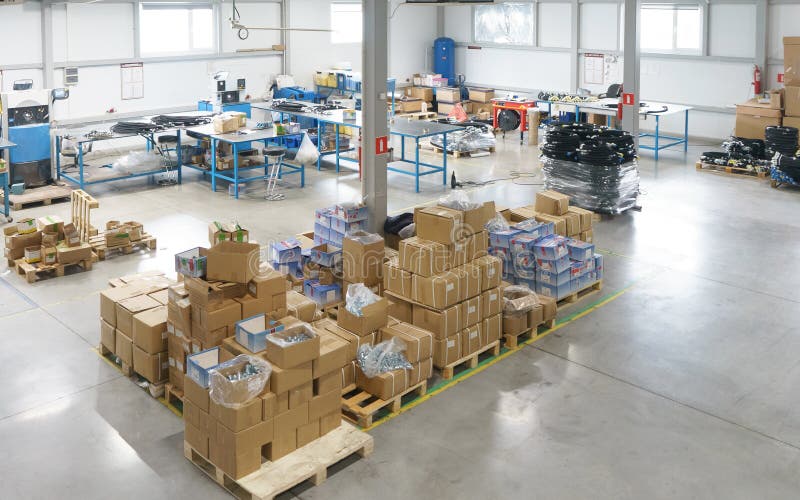 Workplaces with Machines and Organized Warehouse with Many Boxes ...