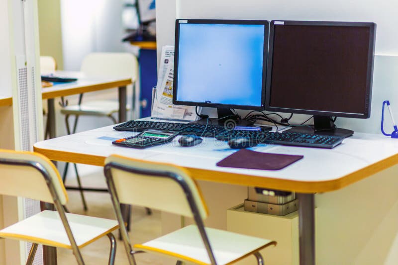 Workplaces at One Table with Two Computers in a Large Shopping Center ...