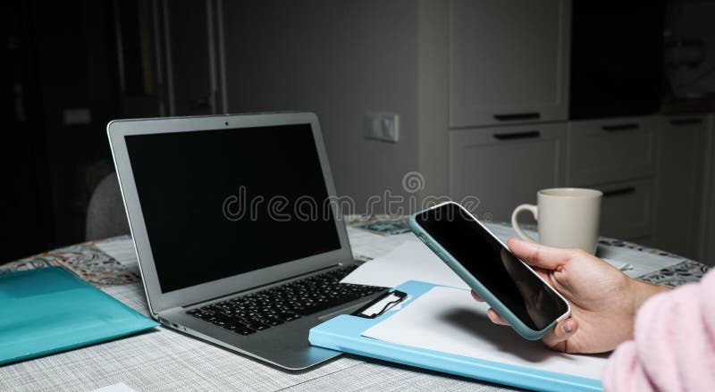 Works at the Computer on the Table Near the Kitchen Stock Photo - Image ...