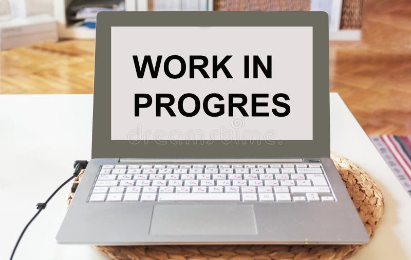 WORKS in PROGRESS Text Written on a Laptop Which Lies on a Table in a ...