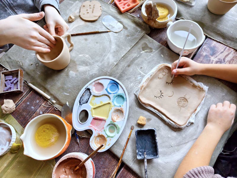 Workshop for Kids. Children Learning How To Use Clay for Making Dishes ...