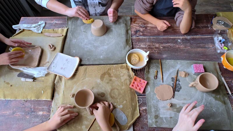 Workshop for Kids. Children Learning How To Use Clay for Making Dishes ...