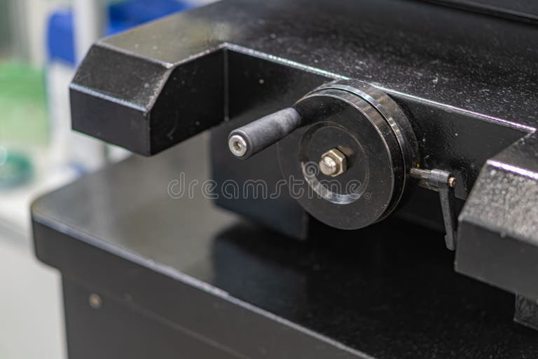 A Workshop or Laboratory Setting Features a Mechanical Assembly on a ...