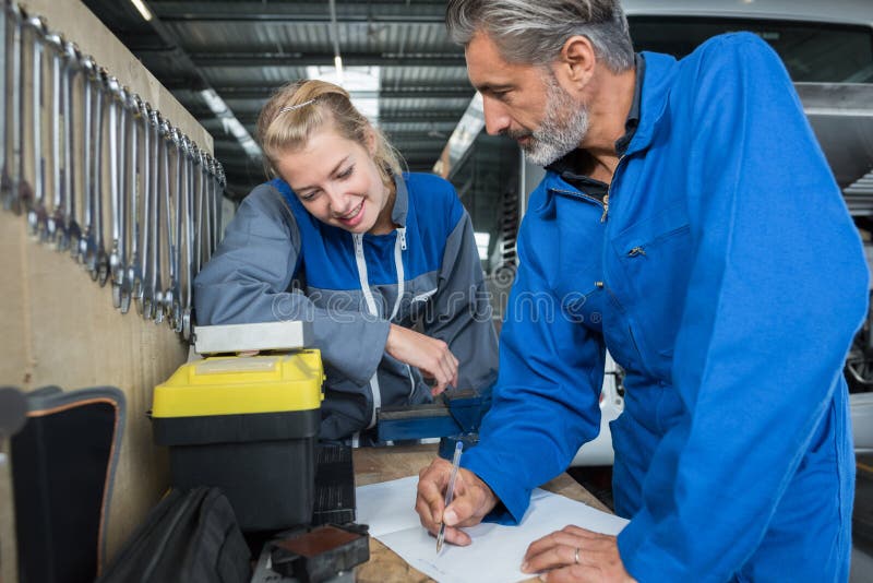 Workshop Mechanics Looking at Papers Stock Image - Image of automotive ...