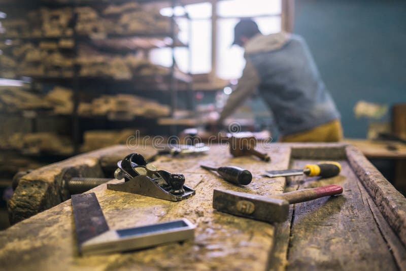 Workshop with Tools and Blurred Carpenter on Background Stock Photo ...