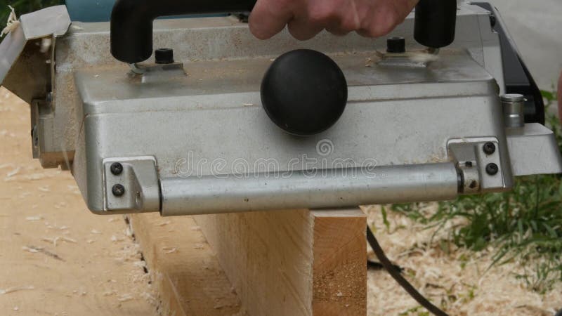 Workshop Workers Use Wood Planing Machine. Chips Fly in Different Side ...