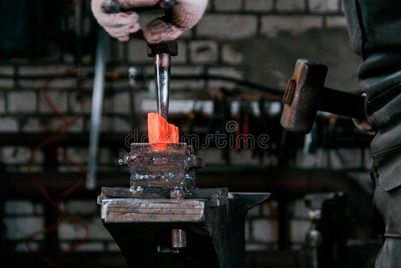 Workspace of Blacksmith. Blacksmith Working with Red Hot Metal at Anvil ...