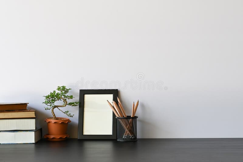 Workspace Books, Pencil, Photo Frame and Bonsai on Office Desk Stock ...