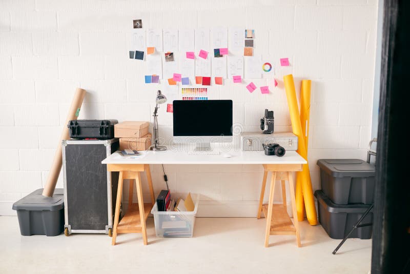 Workspace in Creative Studio with Desk and Computer in Front of Wall ...