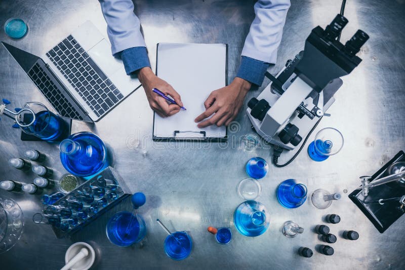 Workspace in Laboratory with Microscope, Laptop, and Laboratory Tools ...