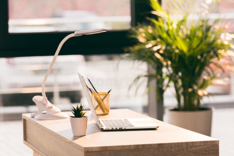 Workspace with Laptop Computer in Modern Empty Office Stock Photo ...