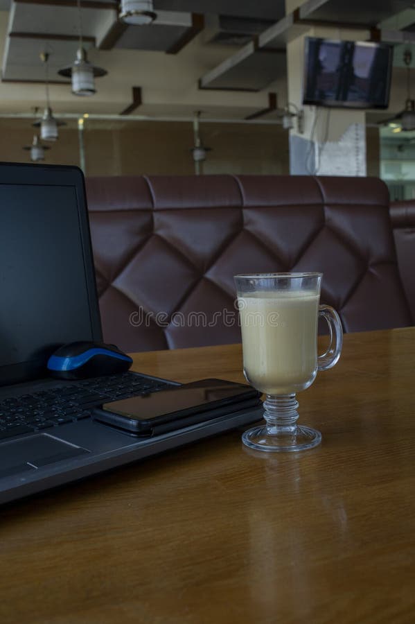 Workspace with Laptop, a Cup of Coffee and a Mouse for a Laptop, Phone ...
