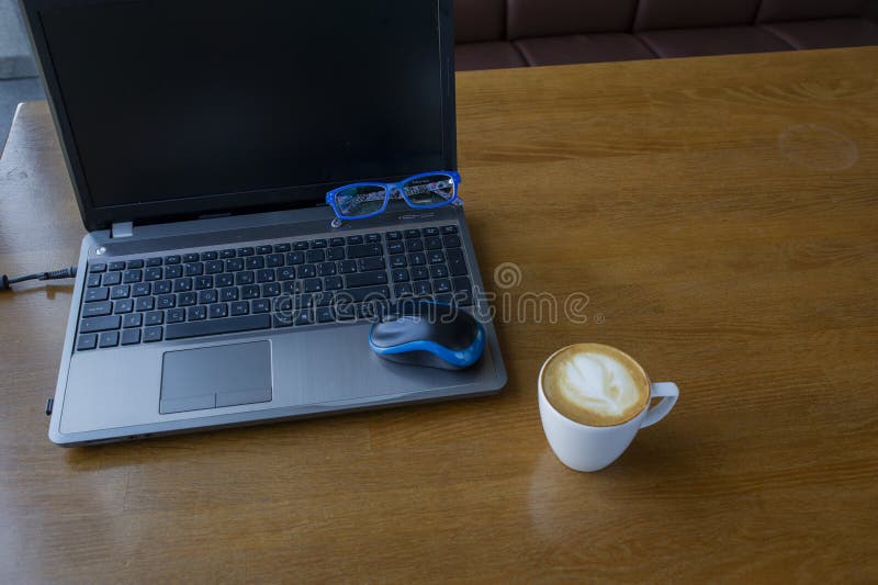 Workspace with Laptop, a Cup of Coffee and a Mouse for a Laptop, Phone ...
