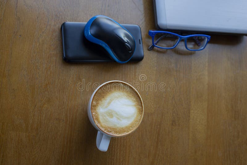 Workspace with Laptop, a Cup of Coffee and a Mouse for a Laptop, Phone ...