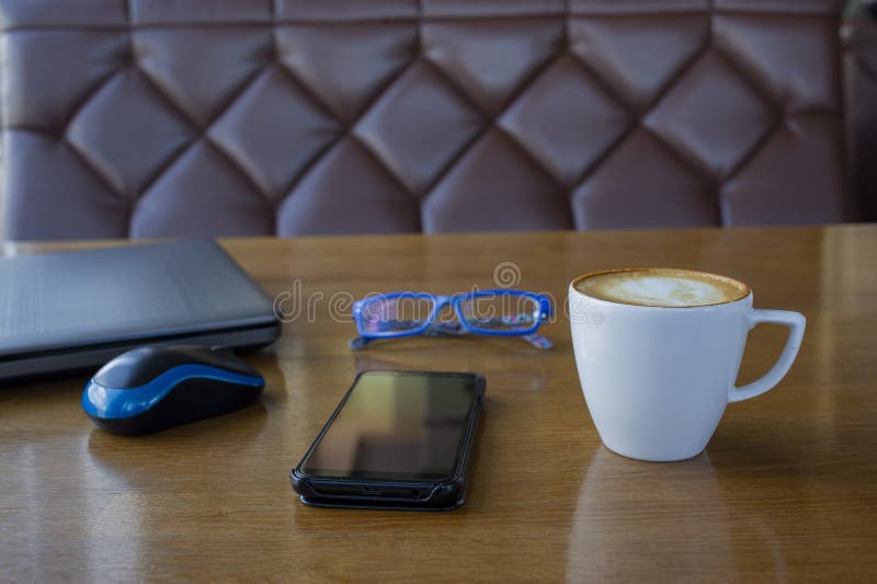 Workspace with Laptop, a Cup of Coffee and a Mouse for a Laptop, Phone ...