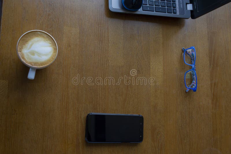 Workspace with Laptop, a Cup of Coffee and a Mouse for a Laptop, Phone ...