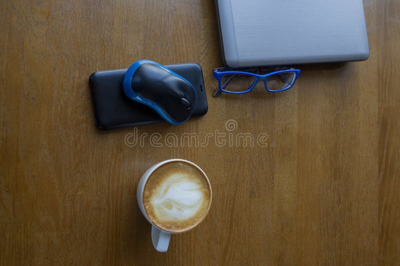 Workspace with Laptop, a Cup of Coffee and a Mouse for a Laptop, Phone ...