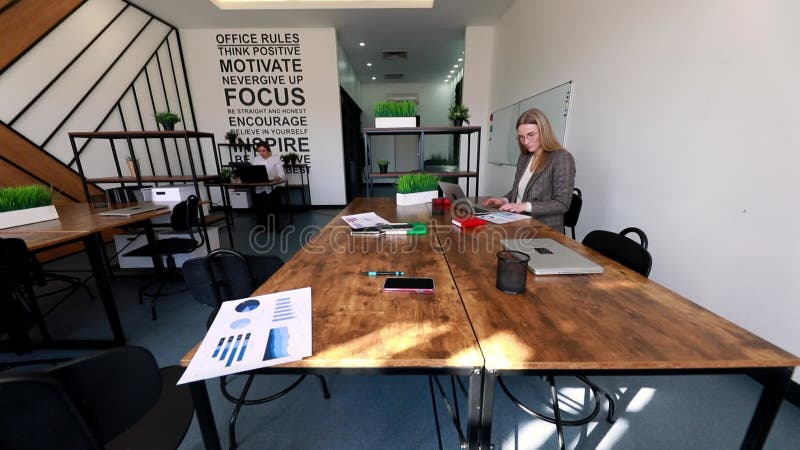 Workspace Setup in Modern Office with Engaged Professionals Working at ...