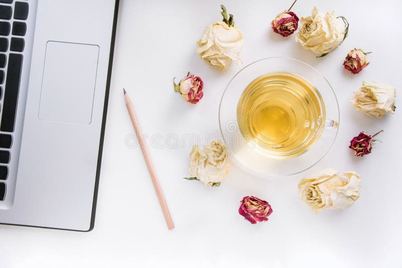 Workspace on Table of Pen, Laptop and Cup of Tea with Dry Roses on Work ...