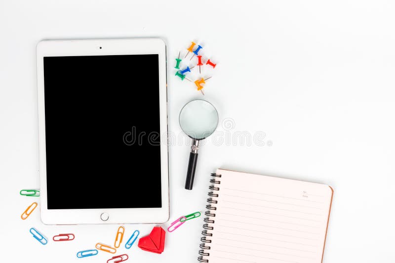 Workspace Top View the Tablet,Magnifying Glass is Placed on a White ...