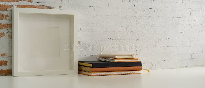 Worktable with Mock Up Frame, Books, Notebooks and Copy Space in Home ...