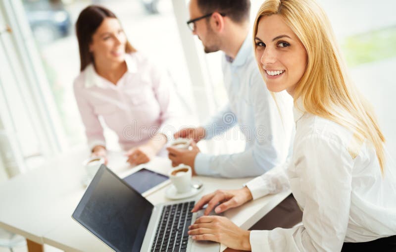 Workteam in Office Working Together on Laptop Stock Photo - Image of ...