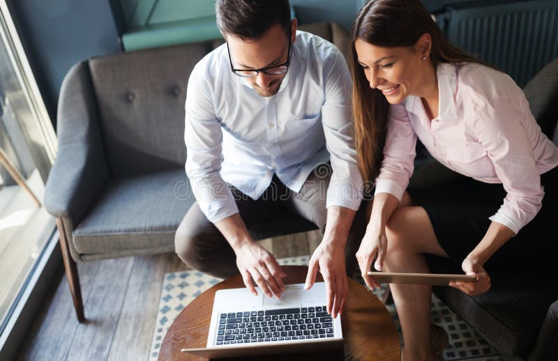Workteam in Office Working Together on Laptop Stock Image - Image of ...