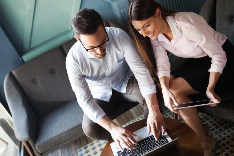Workteam in Office Working Together on Laptop Stock Photo - Image of ...