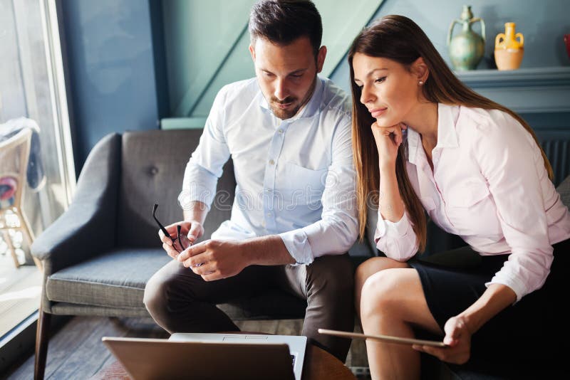 Workteam in Office Working Together on Laptop Stock Image - Image of ...