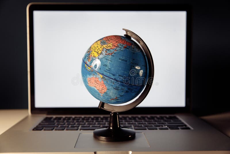 World Globe with Laptop in Office. International Business Concept Stock ...