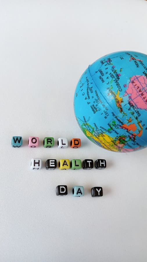 World Health Day Word Made with Plastic Blocks and Blue Mini Globe ...