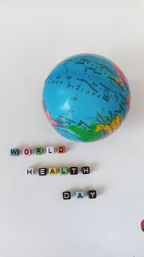 World Health Day Word Made with Plastic Blocks and Blue Mini Globe ...