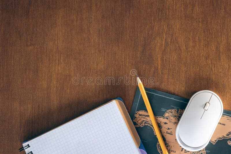 World Map, Computer Mouse and Notebook on a Wooden Table, Top View ...