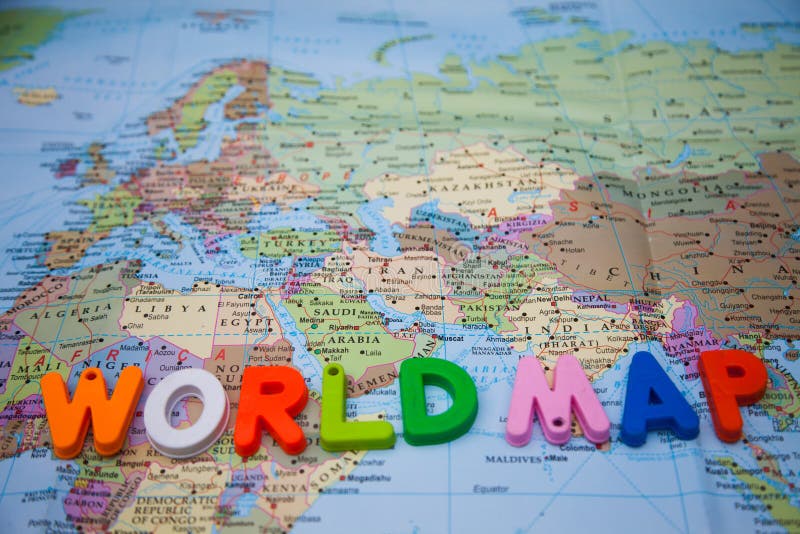 World Map Written with Toy Blocks on a World Map Stock Image - Image of ...