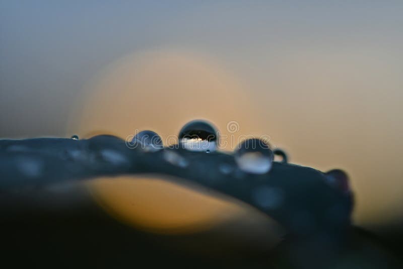 Sunset through a raindrop stock image. Image of raindrop - 163955975