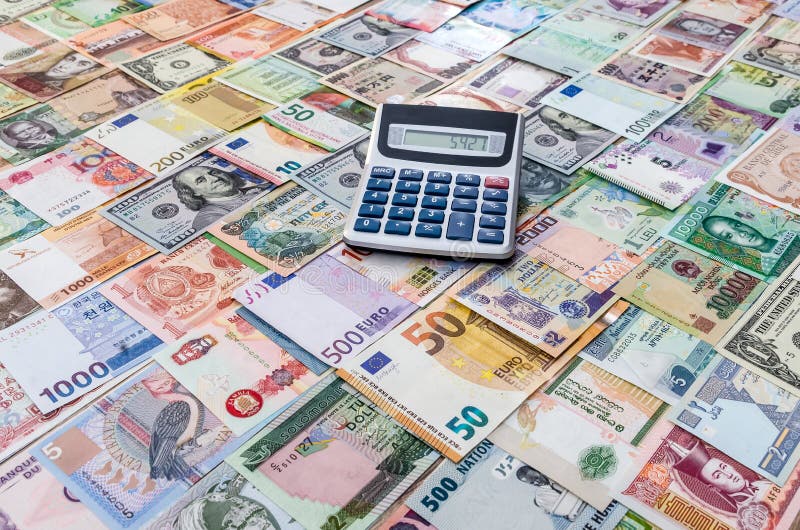 World Money Collection with Calculator on it Stock Photo - Image of ...