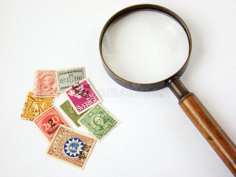 World Postage Stamps and Magnifying Glass Editorial Photo - Image of ...