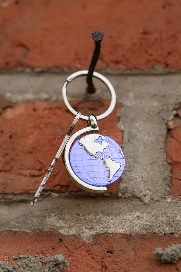 World Symbol with Silver Keys on Abstract Background. Real Estate ...