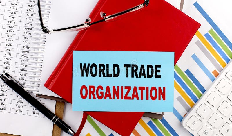 WORLD TRADE ORGANIZATION Text on a Sticky on Red Notebook on Chart ...