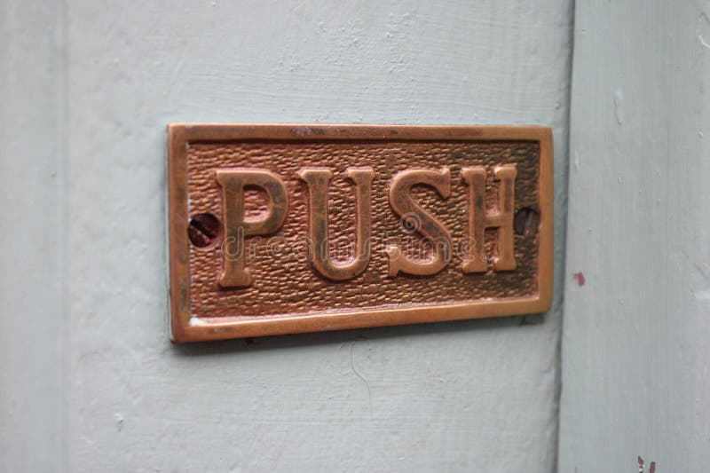 Worn Bronze Push Sign on a External Door Stock Image - Image of bell ...